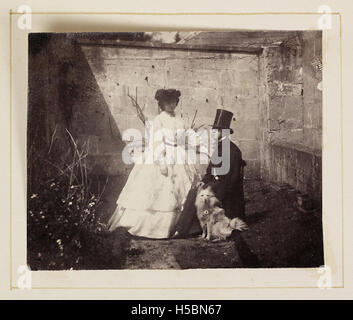 This historical photograph shows Calvert Richard Jones seated with a ...