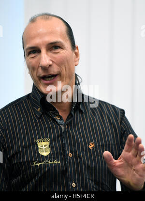 The self-entitled 'King of Germany', Peter Fitzek, prepares for his ...
