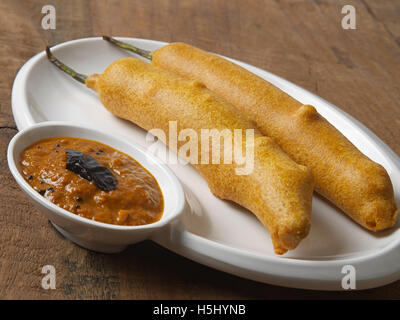 chilli baji with onion chutney on white background Stock Photo - Alamy