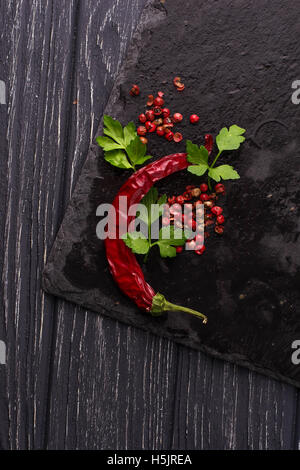 Paprika peppers on stone background as a cooking concept Stock Photo ...