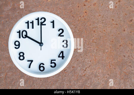 Wall clock show ten o'clock on marble texture. Office clock show 10pm ...