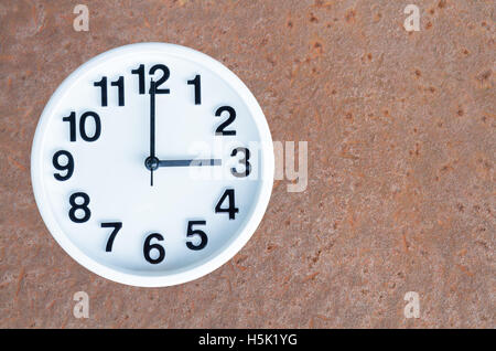 Wall clock show three o'clock on marble texture. Office clock show 3pm ...