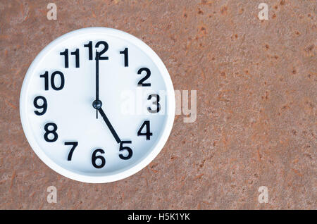 Wall clock show five o'clock on marble texture. Office clock show 5pm ...