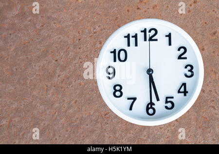 Wall clock show five o'clock on marble texture. Office clock show 5pm ...