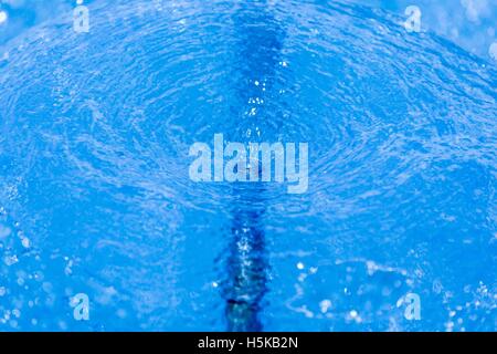 A circular display of water fountain jets in blue spray Stock Photo - Alamy