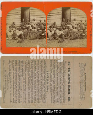 A stereoview image showing African American laborers weighing cotton in ...
