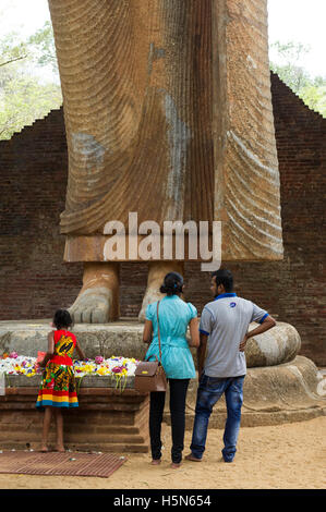 People praying at the God Naatha statue (God Avalokitesvara), 10 meters ...