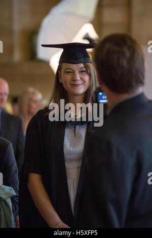 UK University graduation ceremony, proud parent takes photo Stock Photo ...