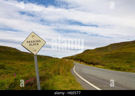 A passing place sign at the roadside on a single track road in the ...