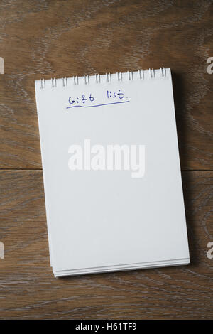 GIFT LIST on paper note. Delicate pink roses on pink background ...