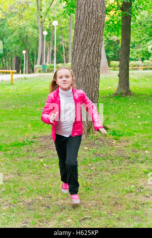 Photo of cute running girl in summer Stock Photo - Alamy