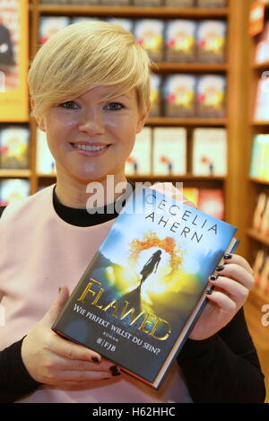 Frankfurt, Germany. 22nd Oct, 2016. Cecelia Ahern signs copies of her ...