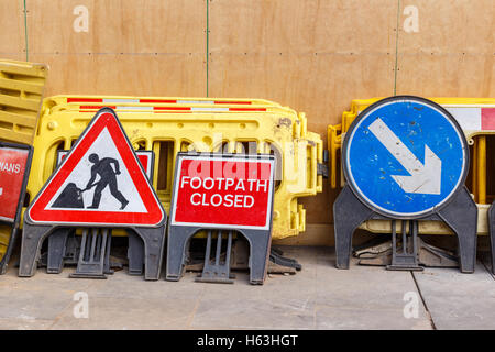 Piles of road and street signs by edge of a road. In Nottingham ...