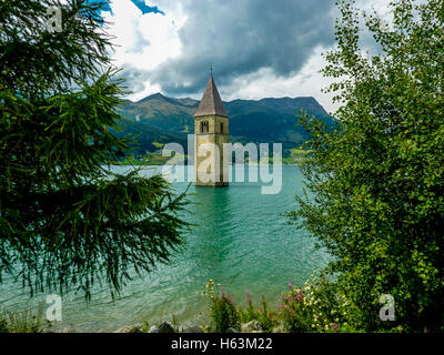 The old church tower of Reschen in the reservoir Lake Reschen, Italy ...