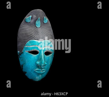 blue ceramic mask of an Asian face on black background Stock Photo - Alamy