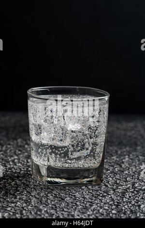 A glass of water with an ice, grayscale Stock Photo - Alamy