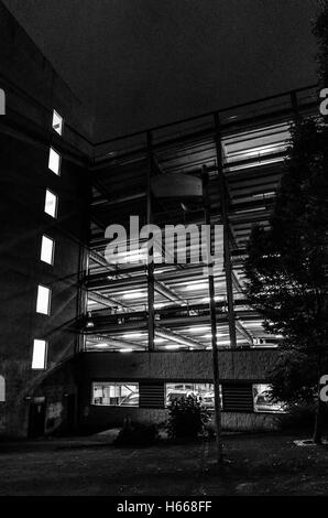 multi-level car parking shot from below. car parking in a tall building ...