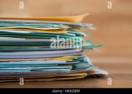 Stack of files on table Stock Photo - Alamy