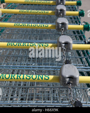 Morrisons supermarket shopping trolleys lined up Stock Photo - Alamy