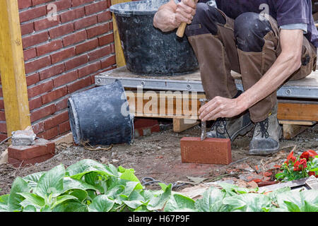 Human hand breaking brick wall. Strength and power Stock Photo - Alamy