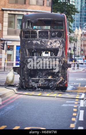 A fire-damaged bus in Bishopsgate, London Stock Photo - Alamy