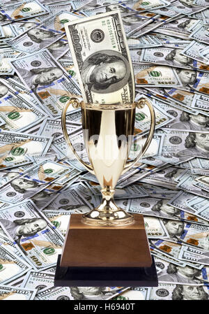 Pile of Money with a Gold Trophy Cup Isolated on a White Background ...