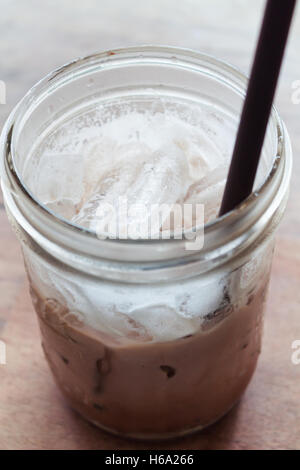 Iced coffee on the wooden table Stock Photo - Alamy