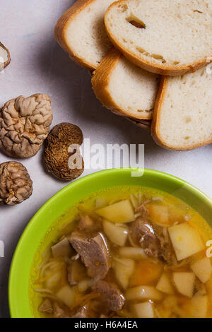 Mushroom Soup on light stone table. Champignon cream soup. Top view ...
