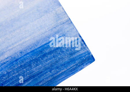 Torn note paper painted in blue on white background Stock Photo - Alamy