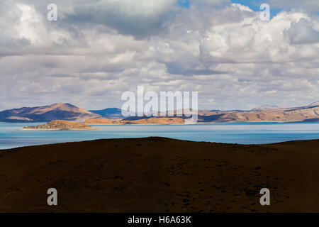 A panoramic shot of a lake on a foot of a mountain Stock Photo - Alamy