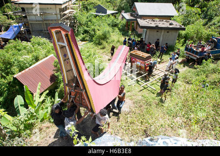 Family and relatives parade the coffin to the special burial site ...