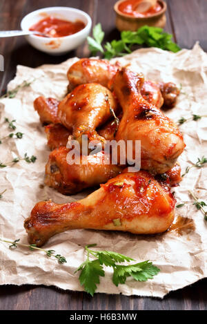 Roasted chicken drumstick on paper Stock Photo - Alamy