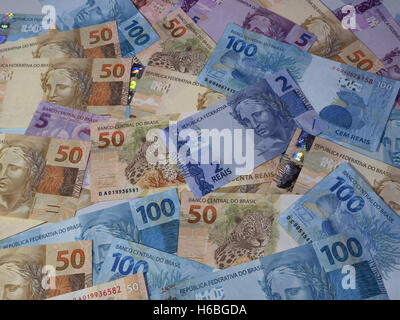 Brazilian real notes, 100 and 50 reais, ten thousand reais, millionaire ...