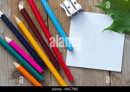 colorful crayons and peace of paper, mock up Stock Photo - Alamy