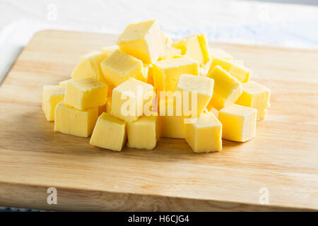 Cutting butter into cubes Stock Photo - Alamy
