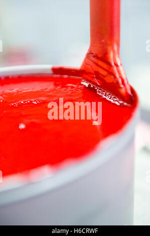 Red paint pot, printing colour Stock Photo - Alamy