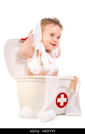 Cute baby boy playing with bandages in a first aid kit Stock Photo - Alamy