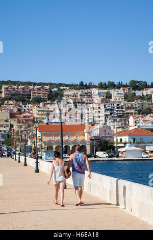 People walking across the Drapano bridge towards the town of Argostoli ...