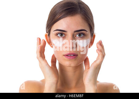 Young woman using cream Stock Photo - Alamy