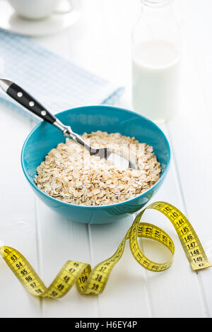 Diet concept. Measuring tape on wooden background with book diary ...