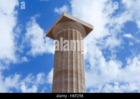 Ancient Greek pillars at the Athens acropolis with blue cloudy sky in ...