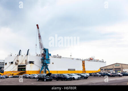 View of a car freighter docking in a commercial port, in the process of ...