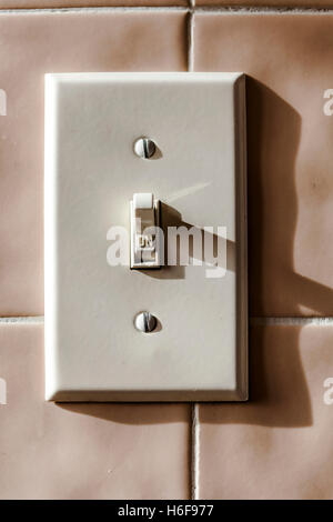 Light switch on tile ceramics wall turned off Stock Photo - Alamy