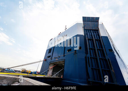 View of a car freighter docking in a commercial port, in the process of ...