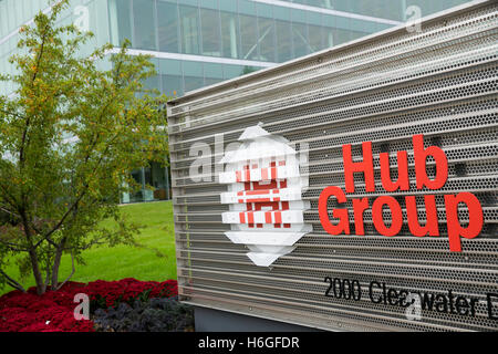 A logo sign outside of the headquarters of The Hub Group in Oak Brook ...