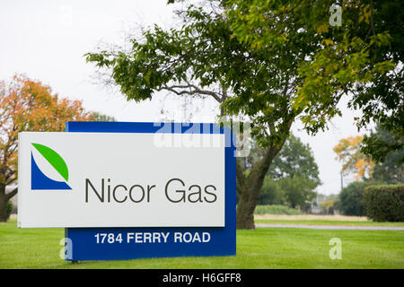 A logo sign outside of the headquarters of Nicor Gas in Naperville ...