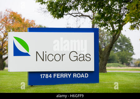 A logo sign outside of the headquarters of Nicor Gas in Naperville ...