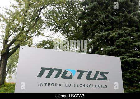A logo sign outside of the headquarters of Motus Integrated ...