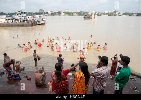 Hindu people bathing on Ahiritola ghat Hooghly River Kolkata West ...