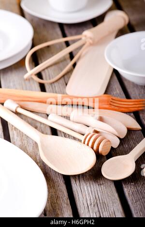 Cutting board and spoons on grey wooden background Stock Photo - Alamy